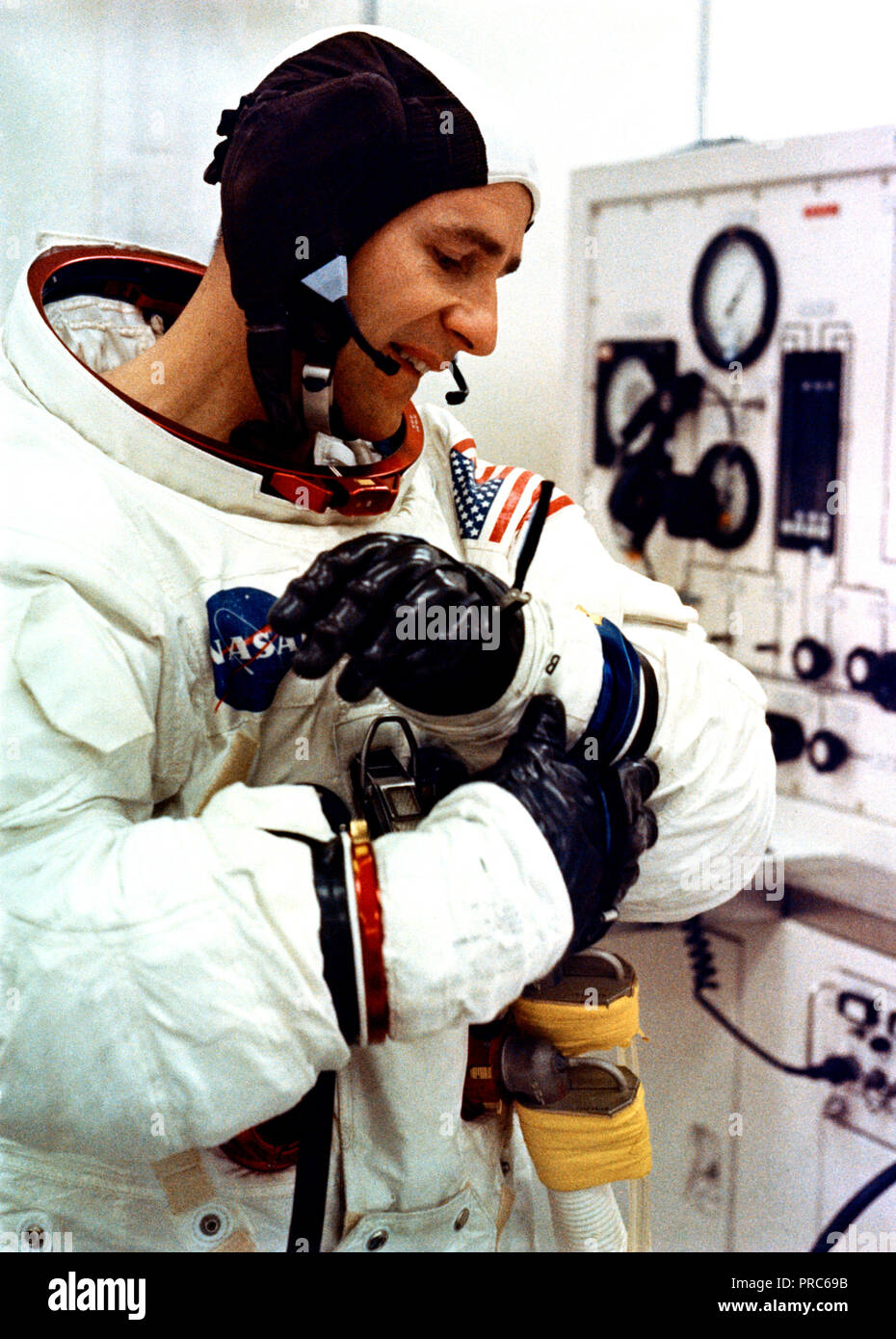 Astronaut Alan L. Bean, Apollo 12 lunar module pilot, suits up in the ...