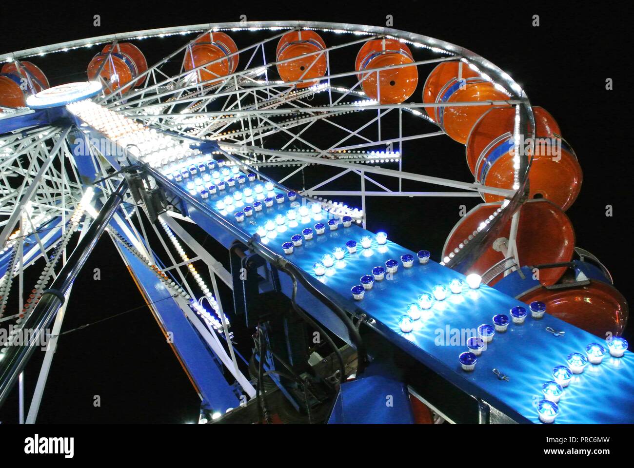 A close-up of a carnival ride, ferris wheel at the Old Home Week ...
