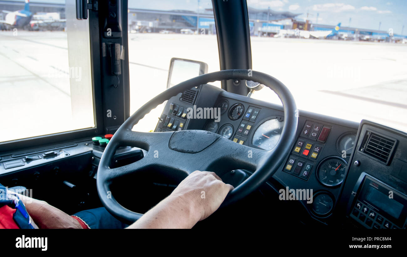 View from driver cockpit of bus delivering passengers to the airplane ...