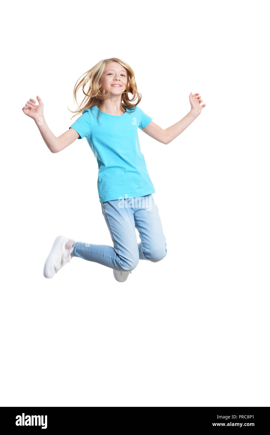 cute girl in casual clothing jumping on white background Stock Photo ...