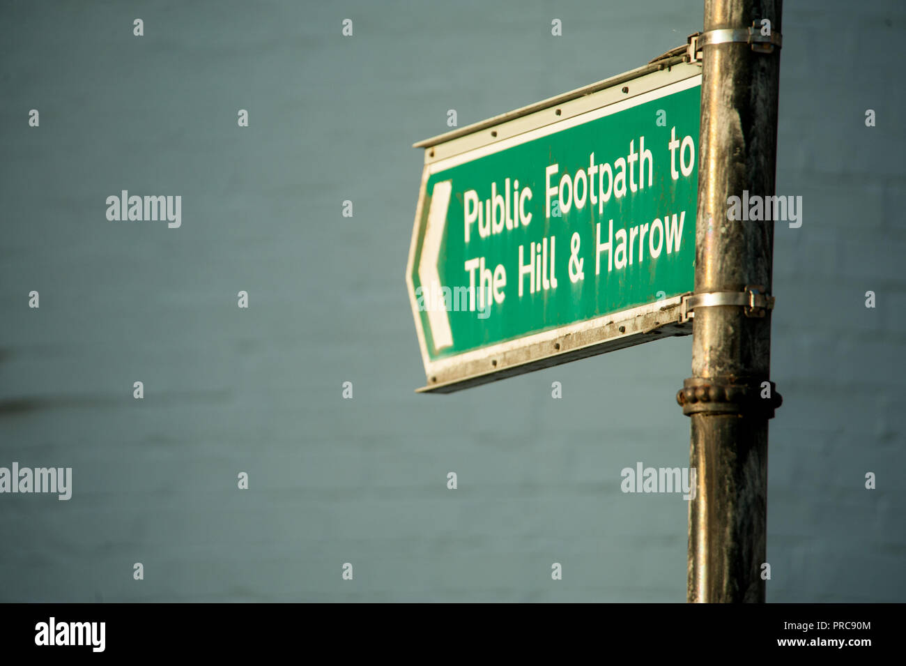 Sign post indicating the public footpath to the hill and harrow Stock ...