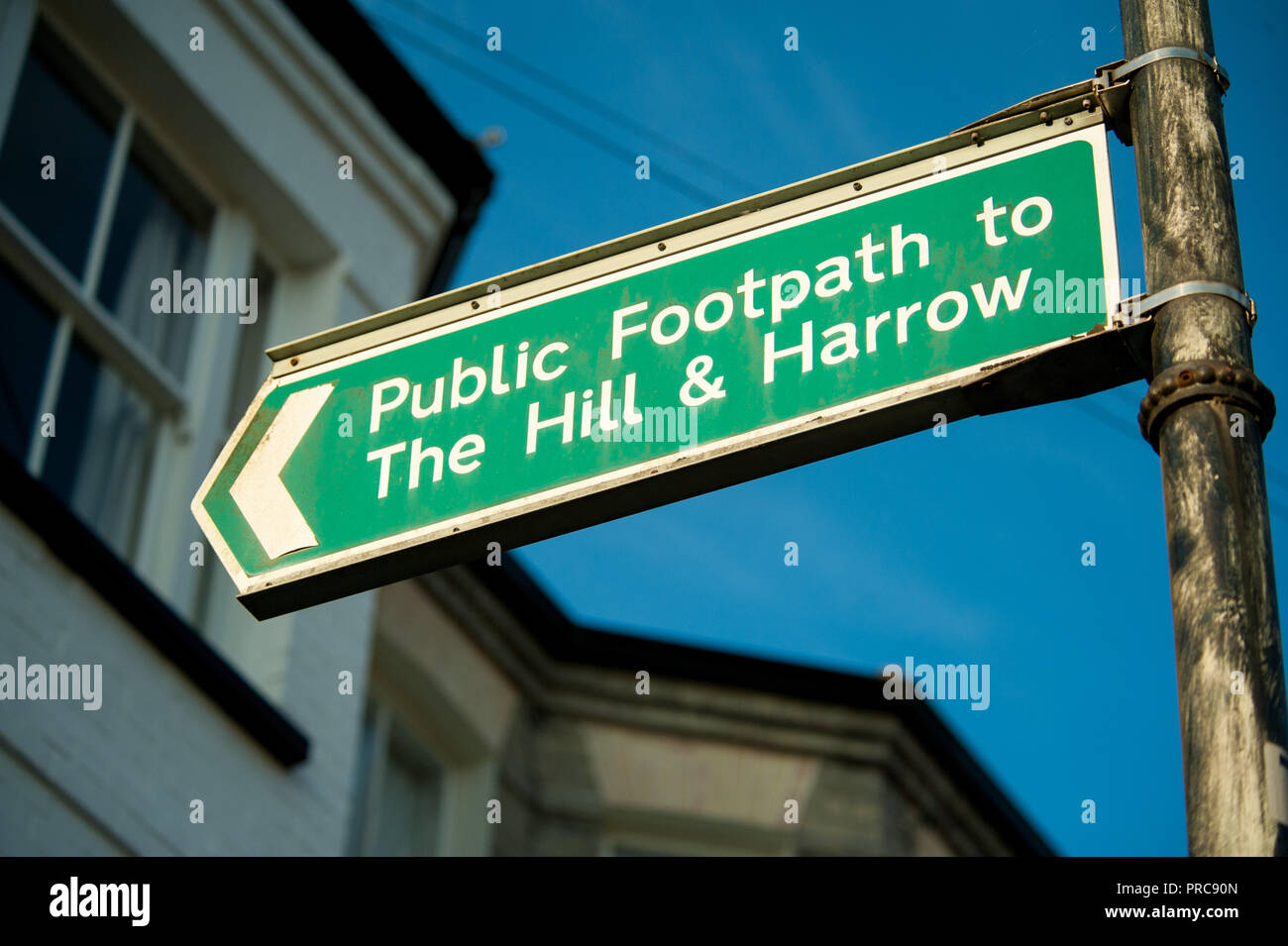 Sign post indicating the public footpath to the hill and harrow Stock ...