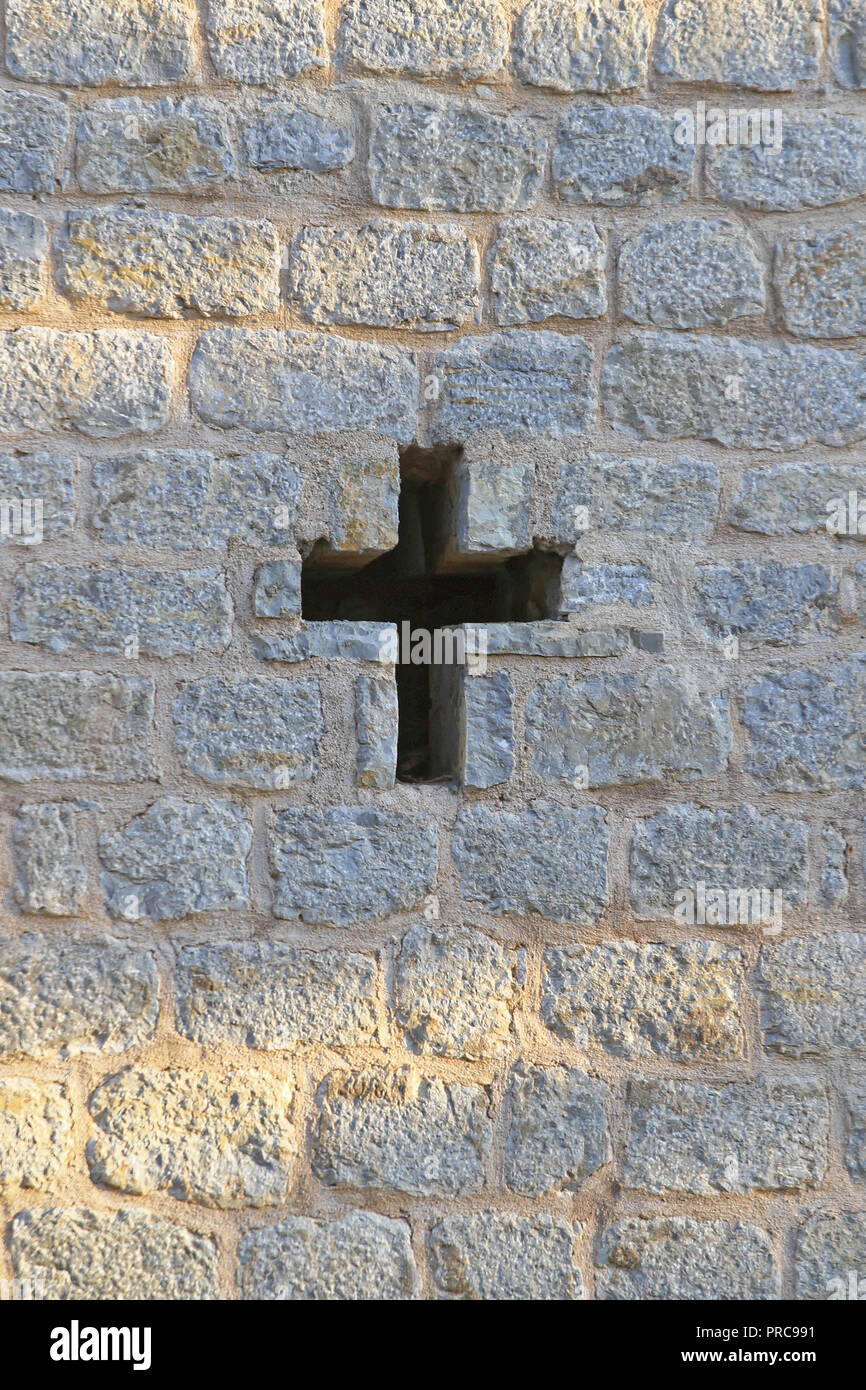 Small Cross Opening at Medieval Stone Wall Stock Photo - Alamy