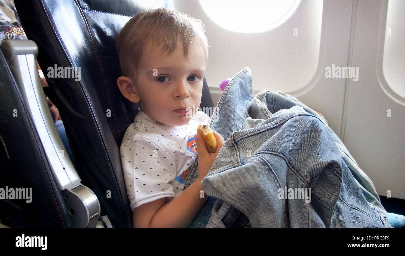 Child airplane eating hi-res stock photography and images - Alamy