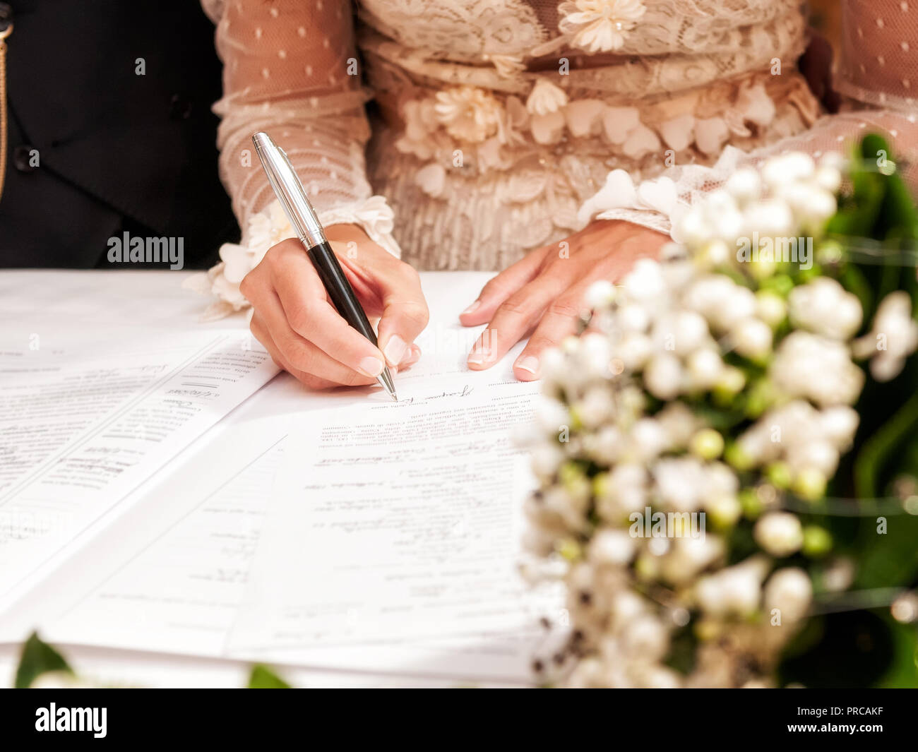 Bride signs marriage certificate document hi-res stock photography and ...
