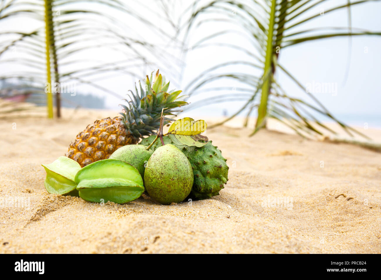 Exotic fruits on the sand near the ocean Stock Photo - Alamy
