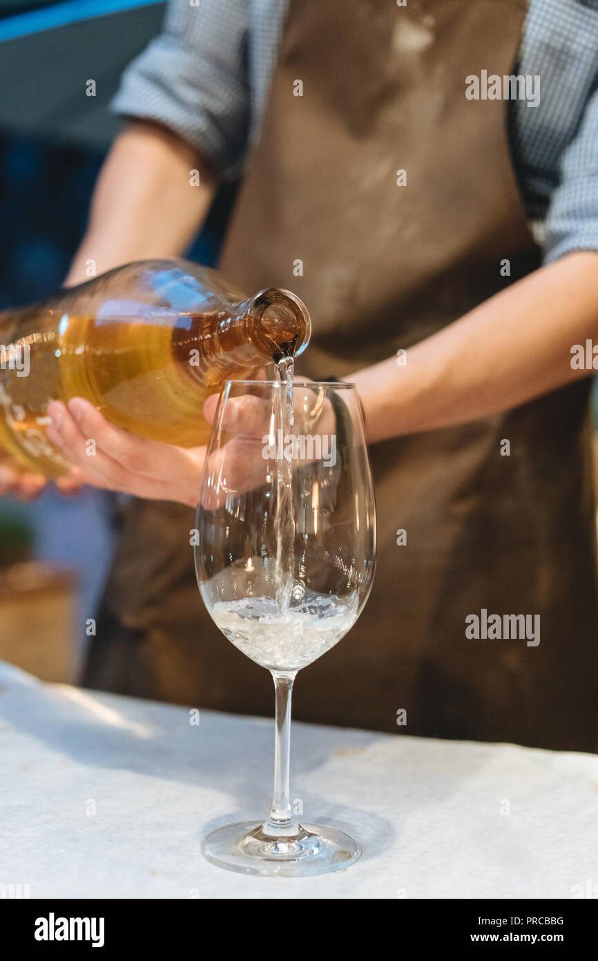 Waiter pouring wine restaurant table hi-res stock photography and ...