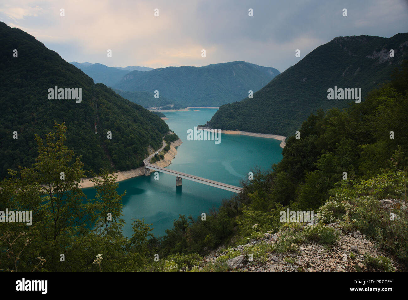 A view into the Piva lake (Pivsko jezero) going through a valley with ...