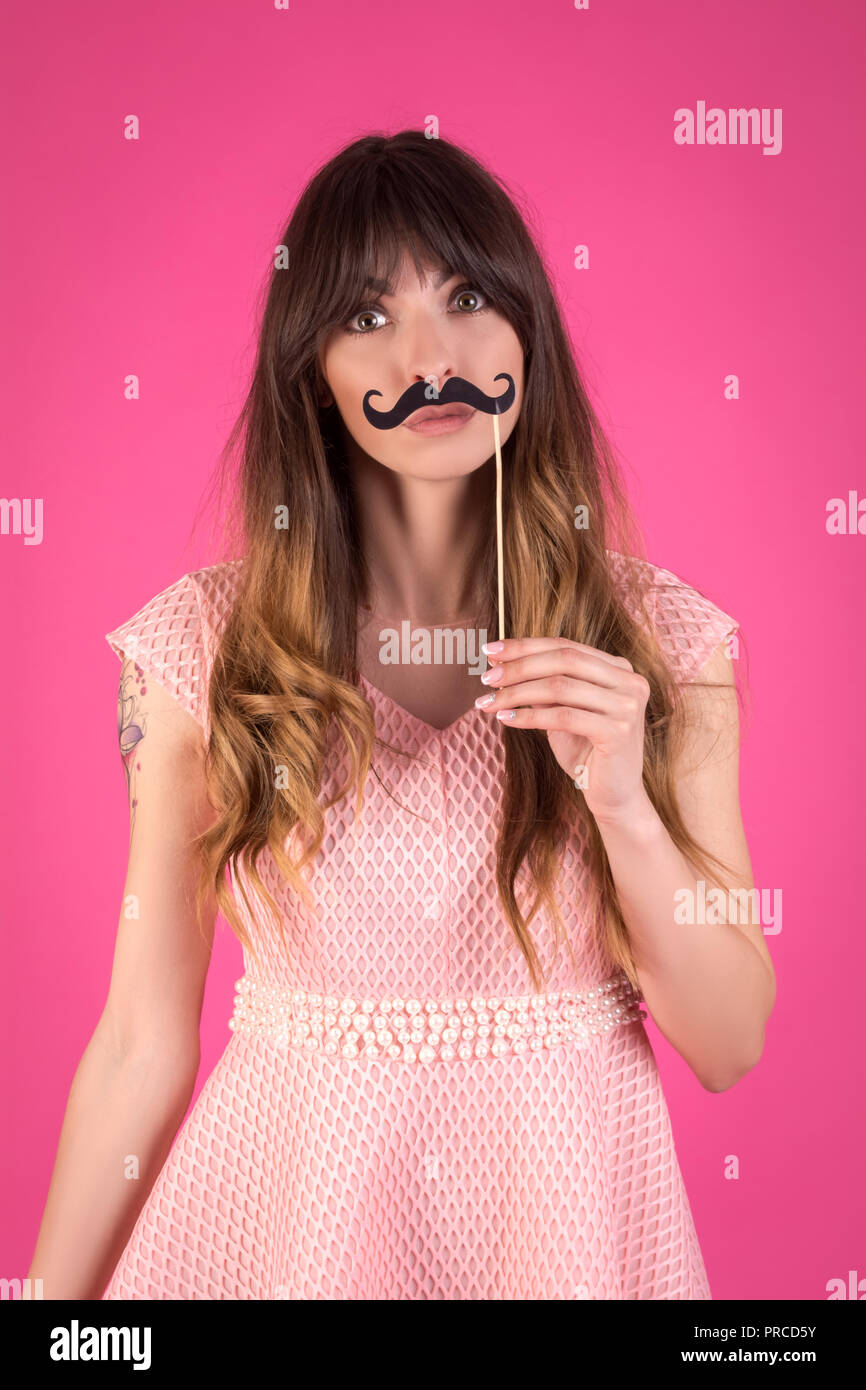 Pretty girl fake mustache hi-res stock photography and images - Alamy