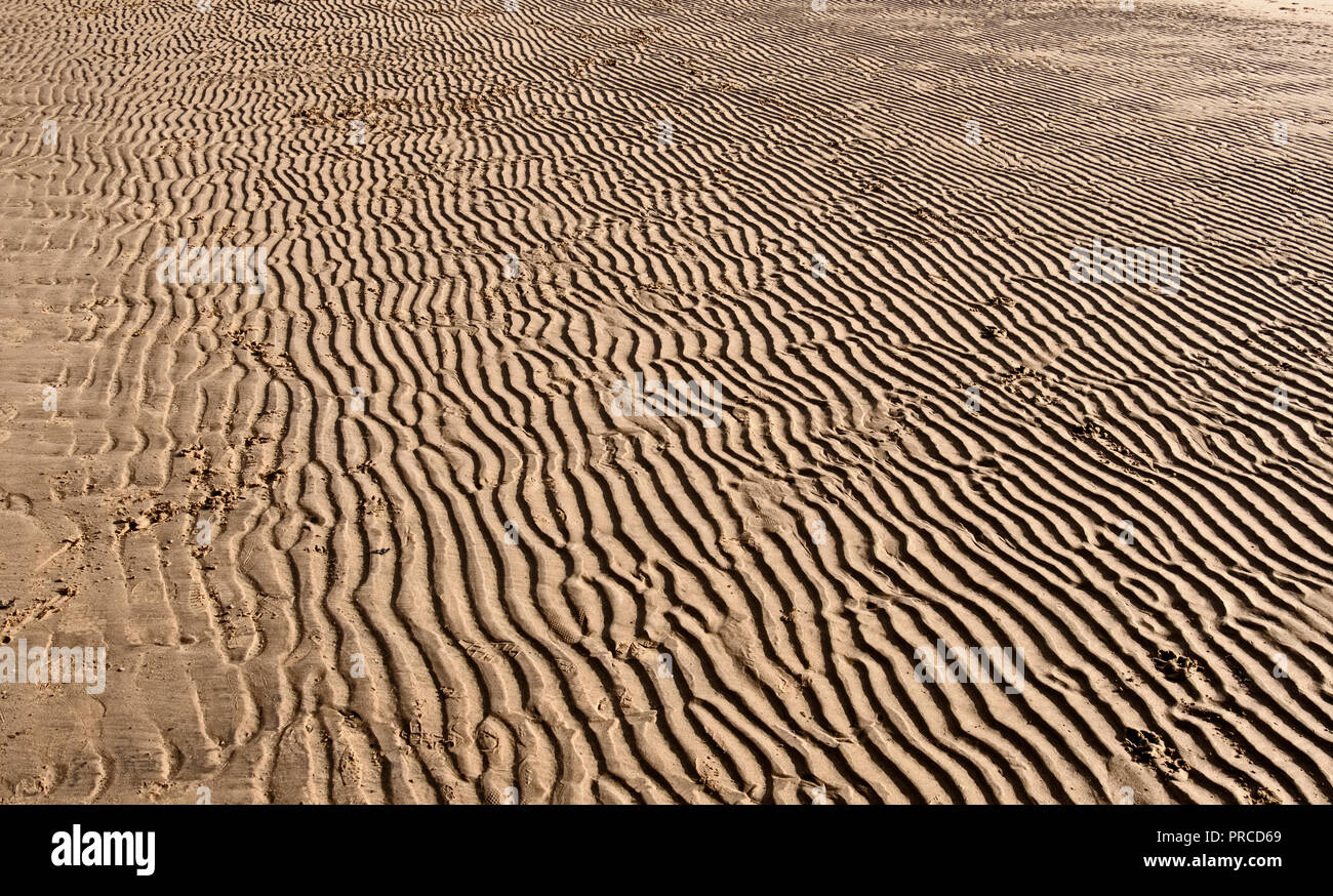 Patterns in the sand on a beach Stock Photo - Alamy