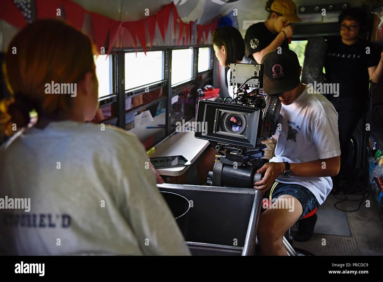 New York, NY; Aug 2018 - A film crew crowds inside a bus to shoot a ...
