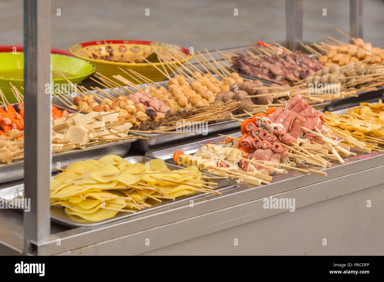 Street food asia. Street food on a stick Stock Photo - Alamy