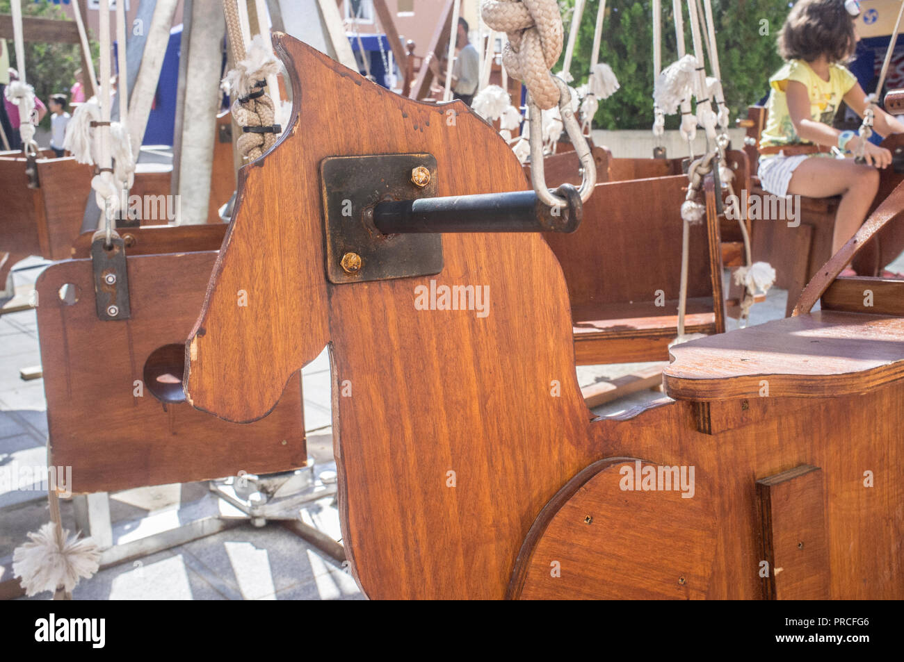 Wooden human powered carousel at Almossassa Festival of Badajoz ...