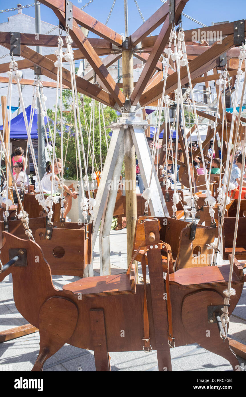 Badajoz, Spain: 29 sept: Wooden human powered carousel at Almossassa ...
