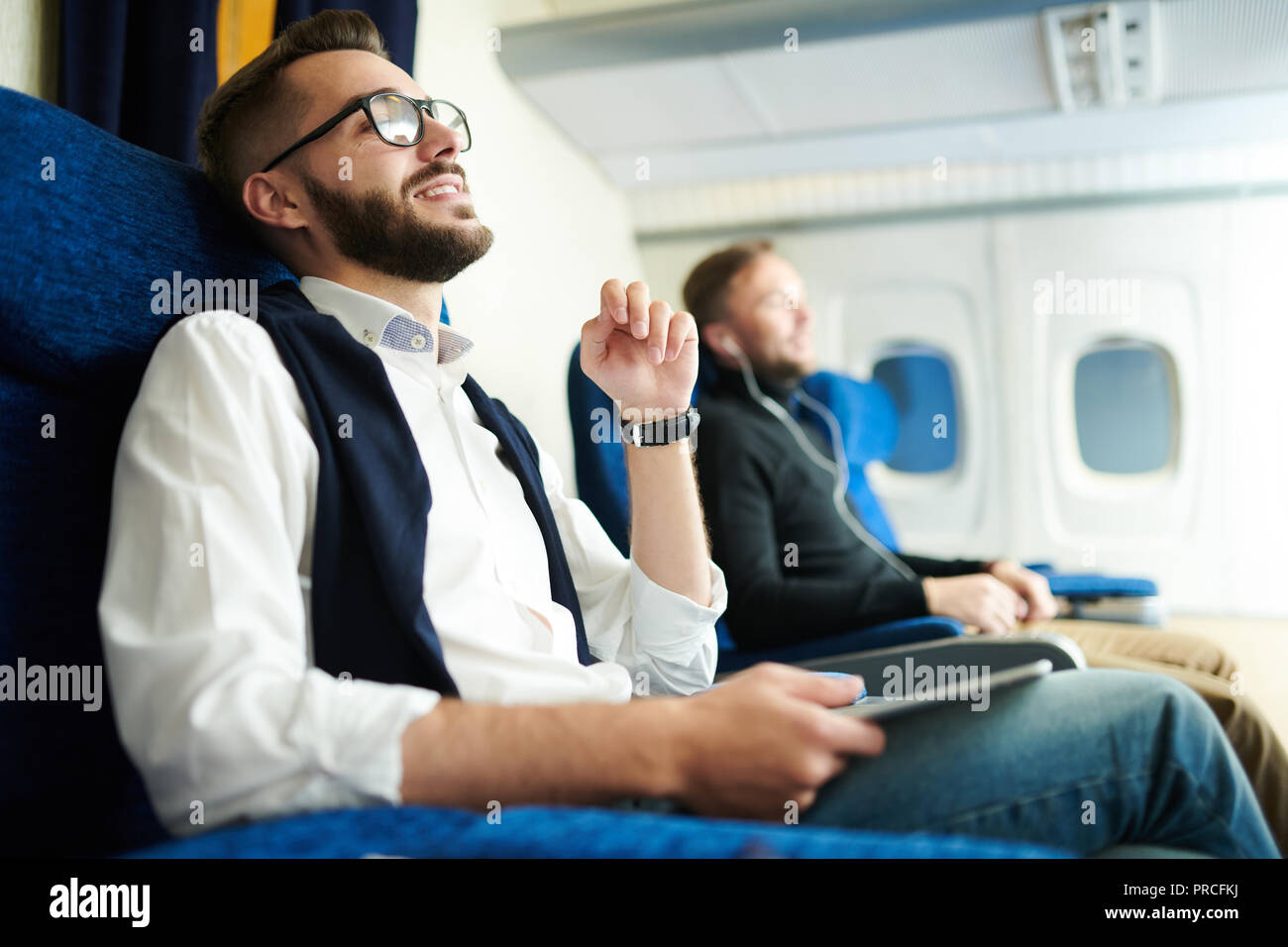 Man first class flight hi-res stock photography and images - Alamy