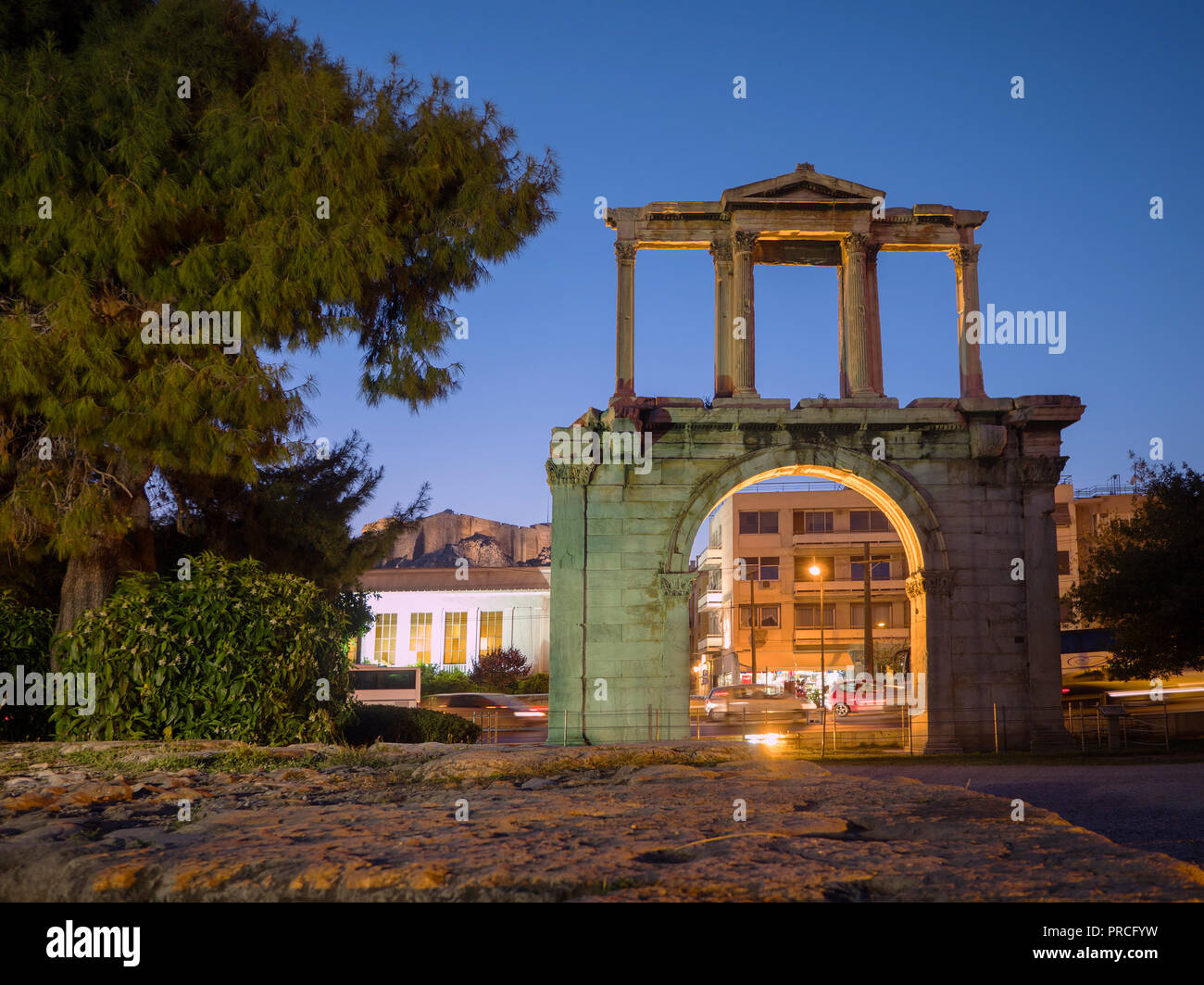 Hadrian's gate illuminated at night with Acropolis on the background in ...