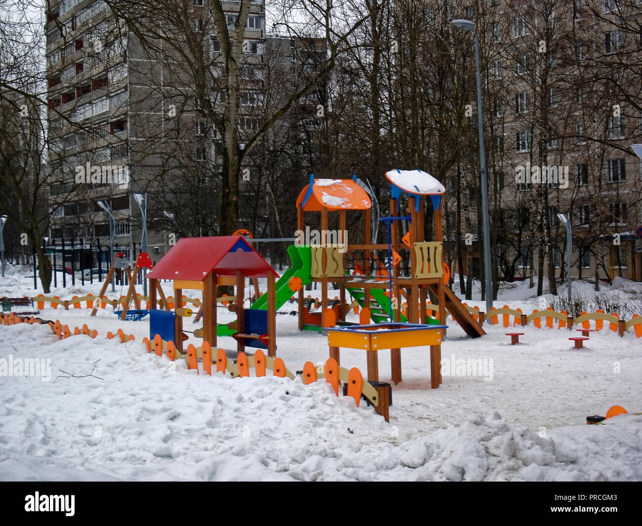 Empty children playground winter snow hi-res stock photography and ...