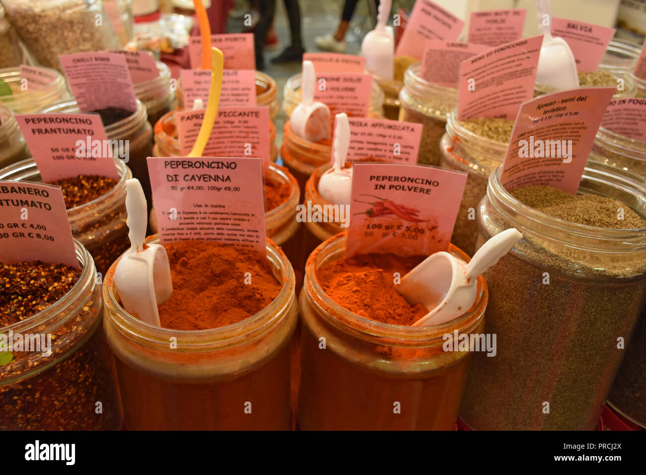 Display of various types of hot peppers in powder and seeds Stock Photo ...