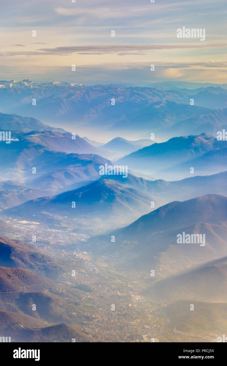 Mist forms in the valleys of the Swiss Alps Stock Photo - Alamy