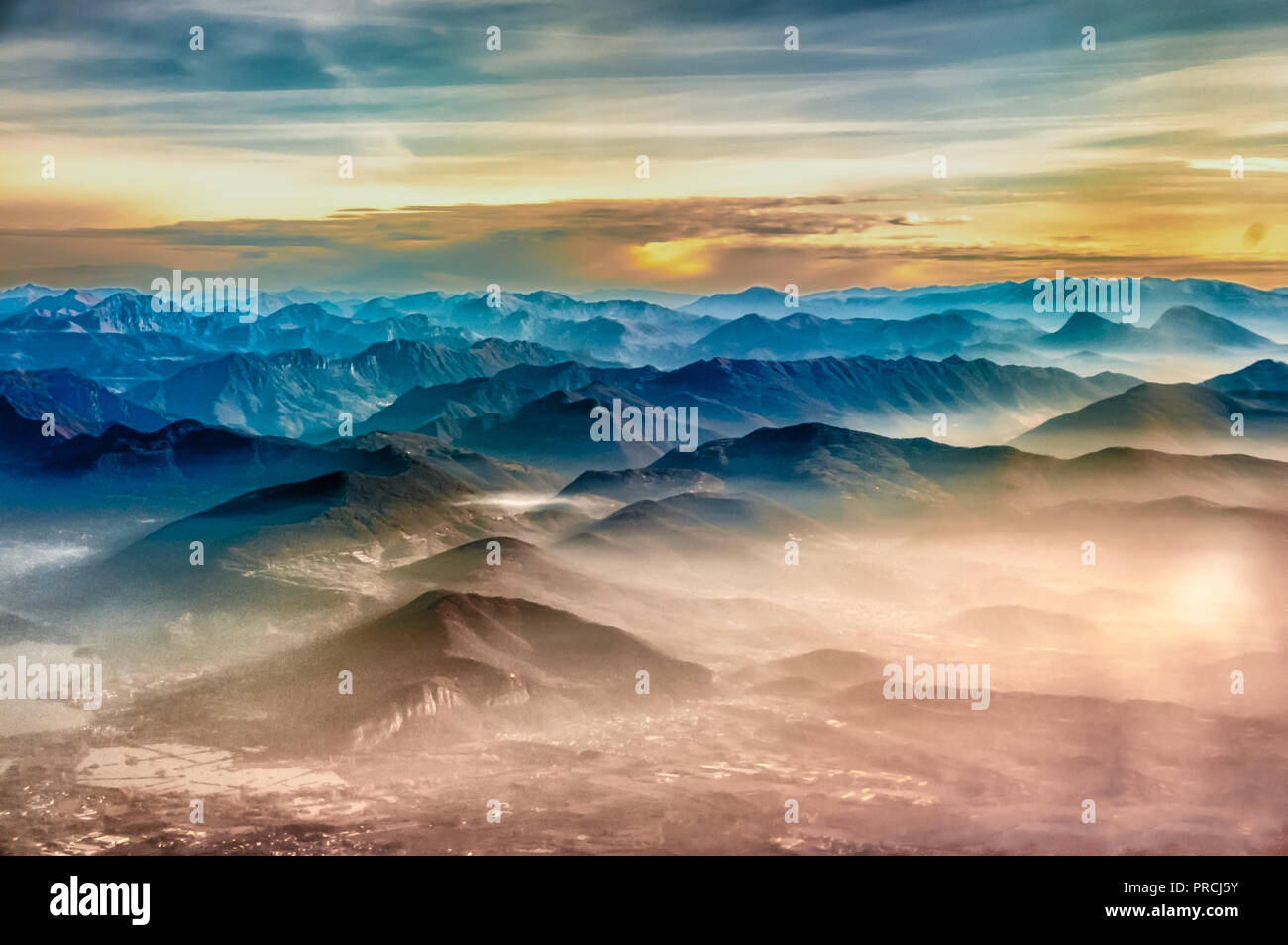 Mist forms in the valleys of the Swiss Alps Stock Photo - Alamy
