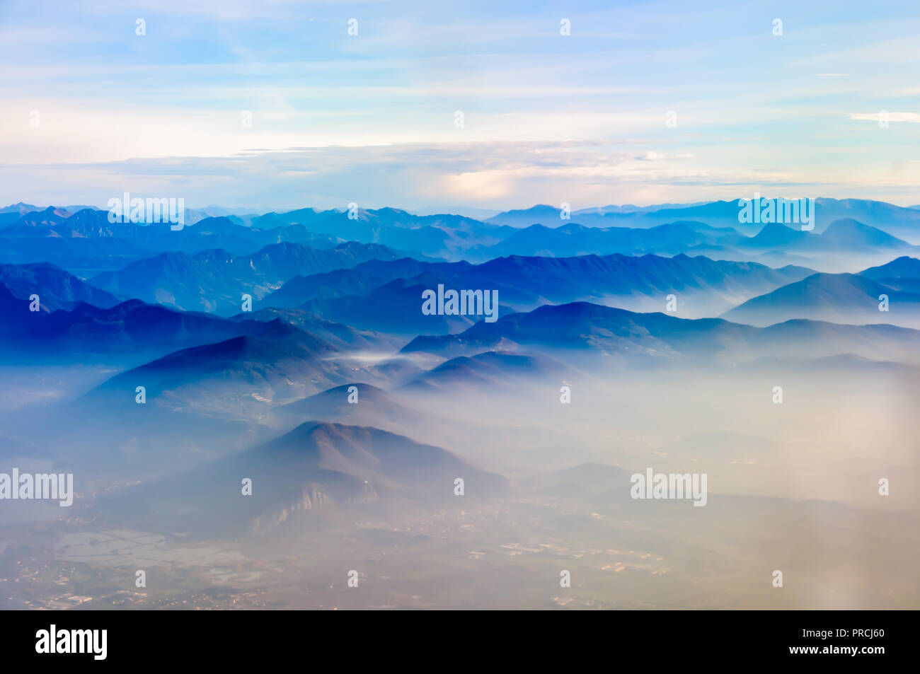 Mist forms in the valleys of the Swiss Alps Stock Photo - Alamy