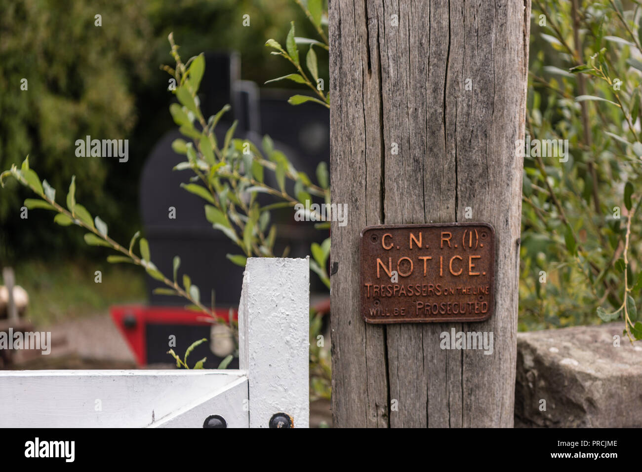Rusty sign saying "GNR Notice. Trespassers on the line will be ...