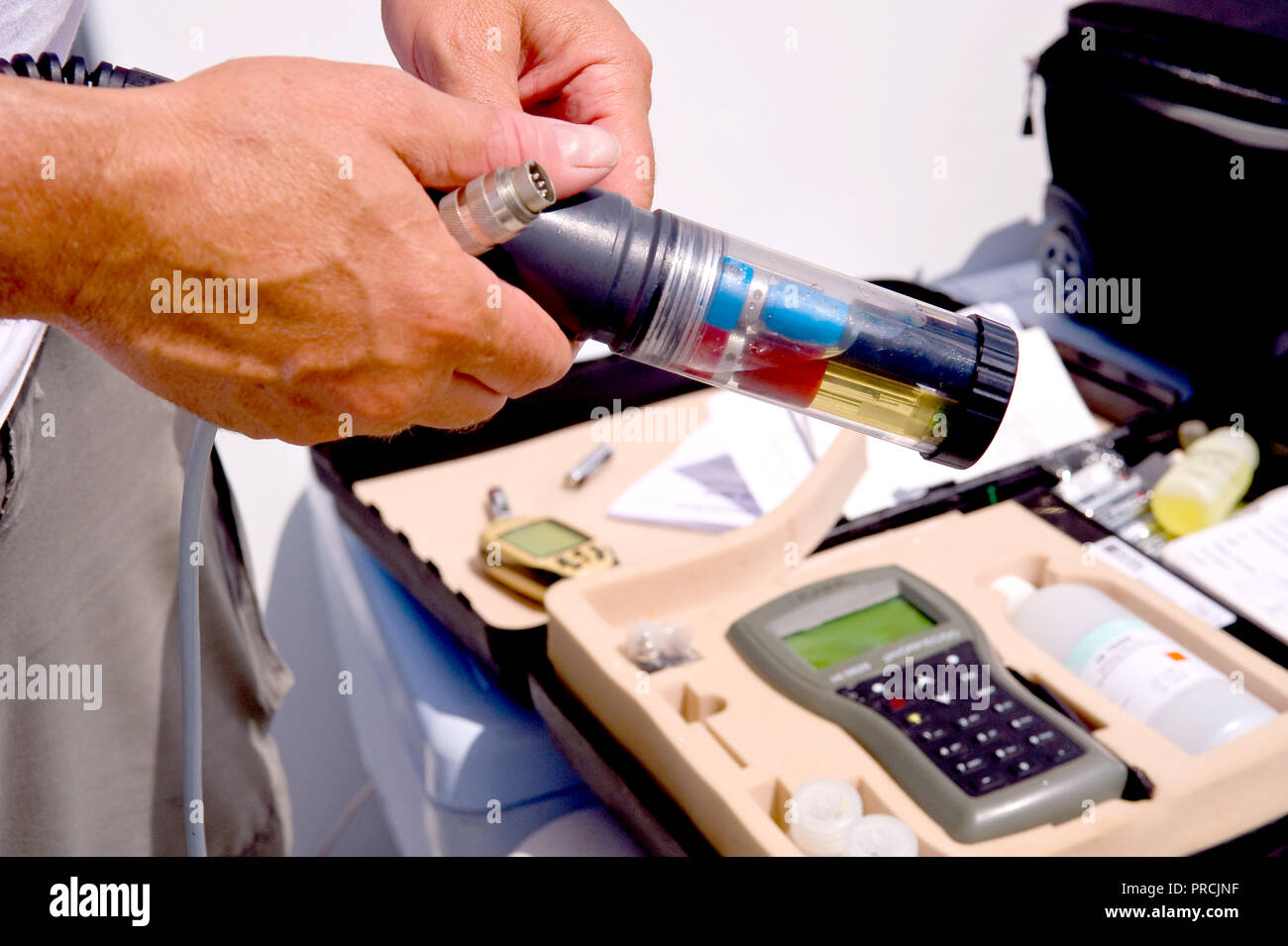 EPA contracter taking a water sample in the Gulf of Mexico after the ...