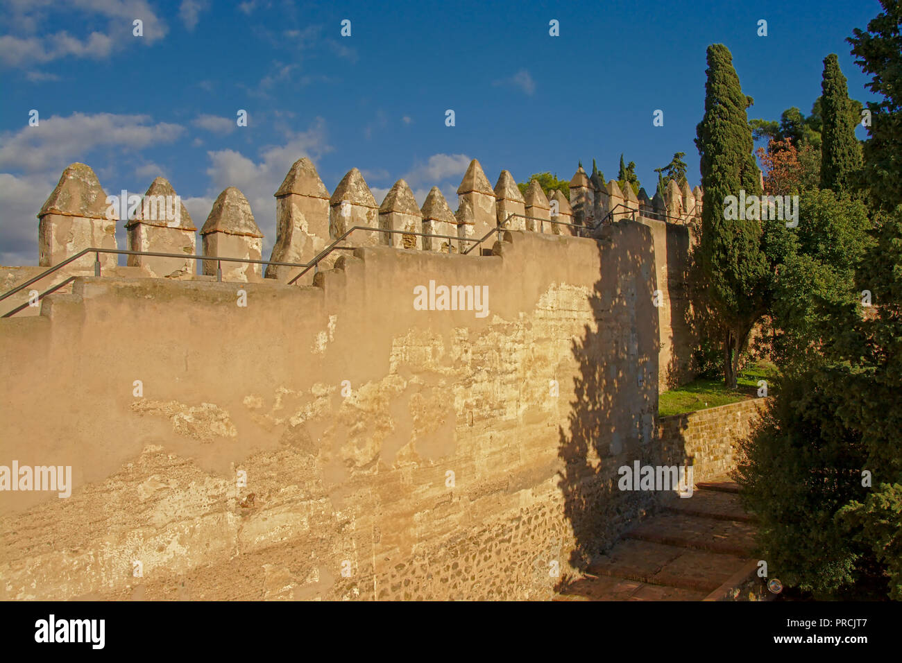 Fortified wall with crenelations of Gibralfaro moorish medieval castle ...