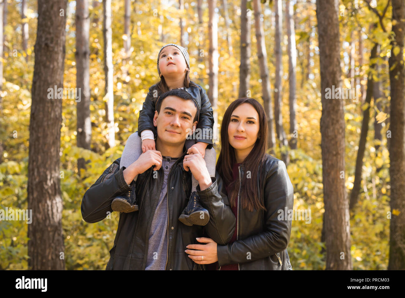 Children, nature and family concept - Portrait of happy family over ...