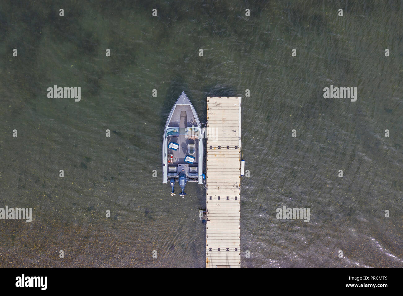 Aerial birdseye view of a speed boat at a pier Stock Photo - Alamy
