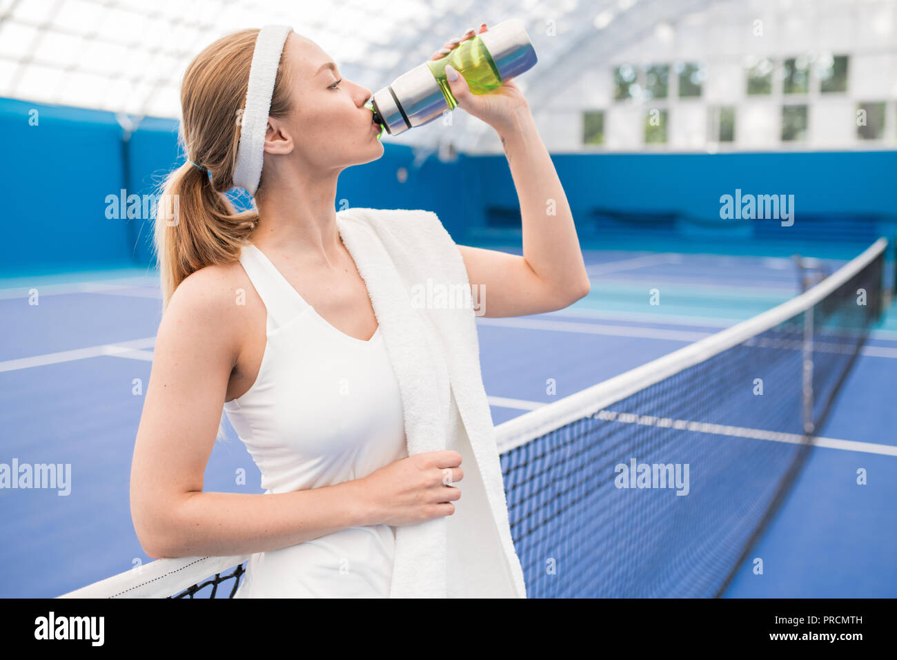 Young Woman Refreshing after Practice Stock Photo - Alamy