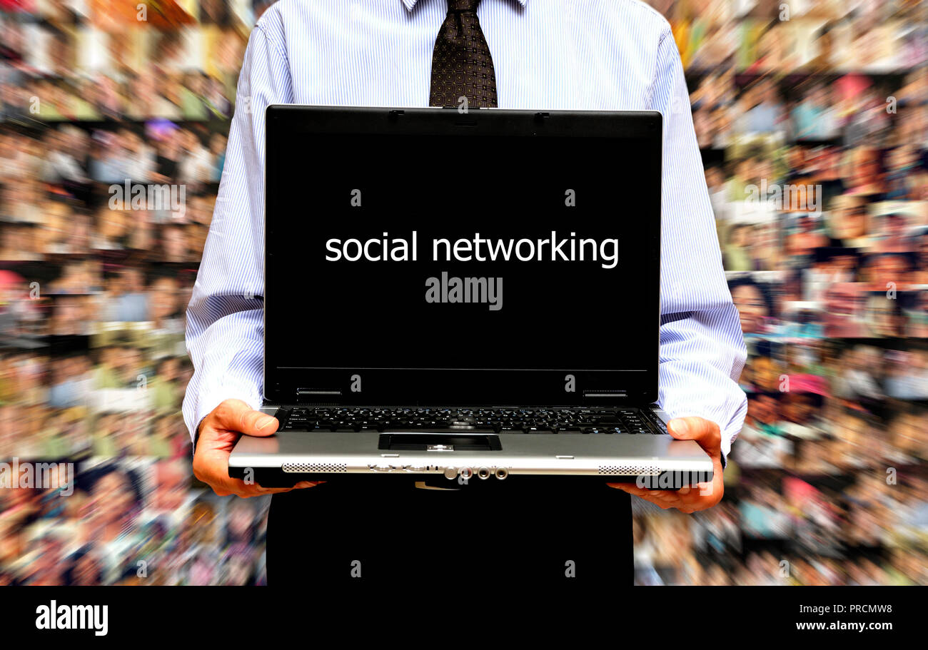 man holding a laptop, concept for social media and social networking ...