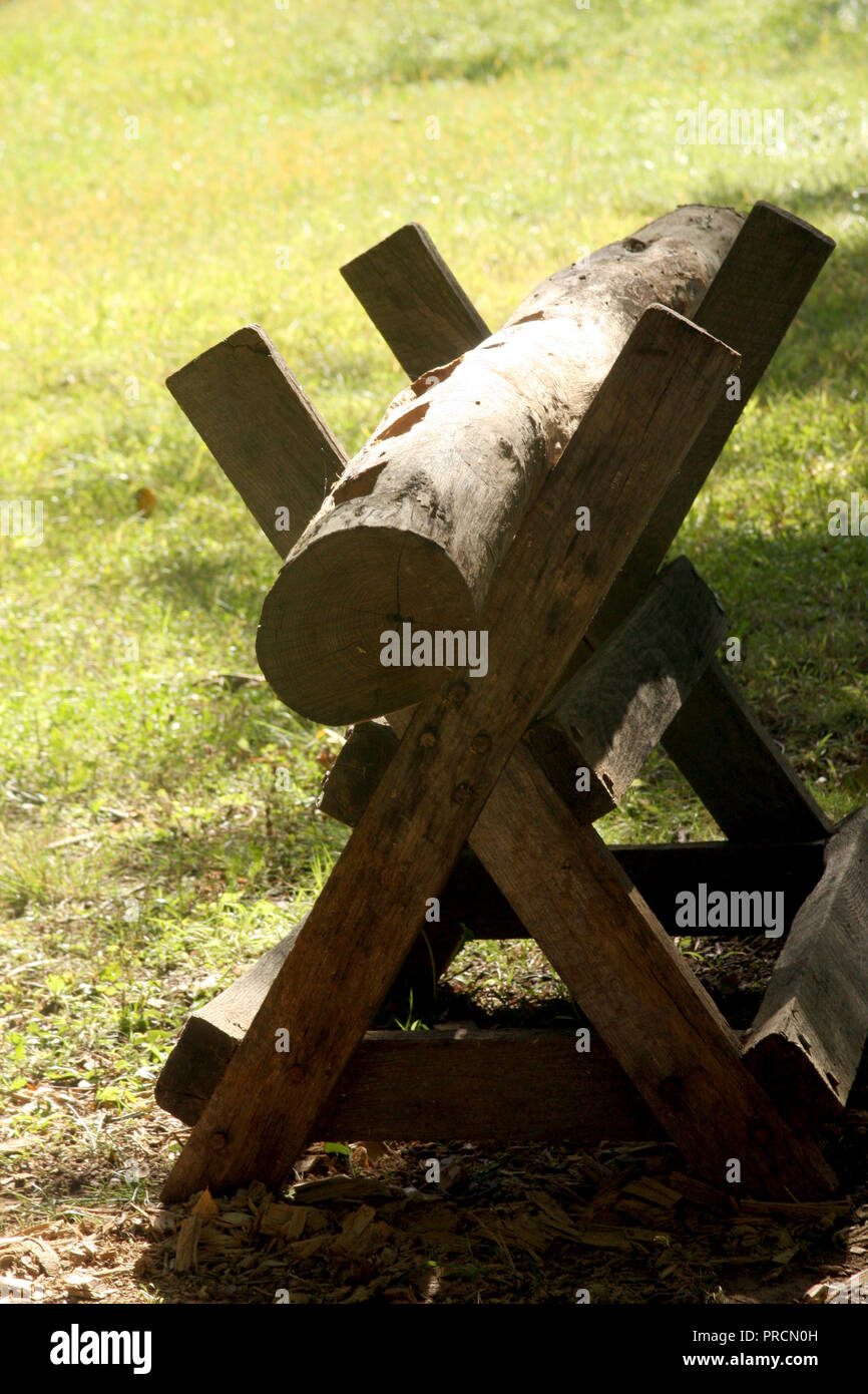 Old traditional sawbuck for cutting logs Stock Photo - Alamy