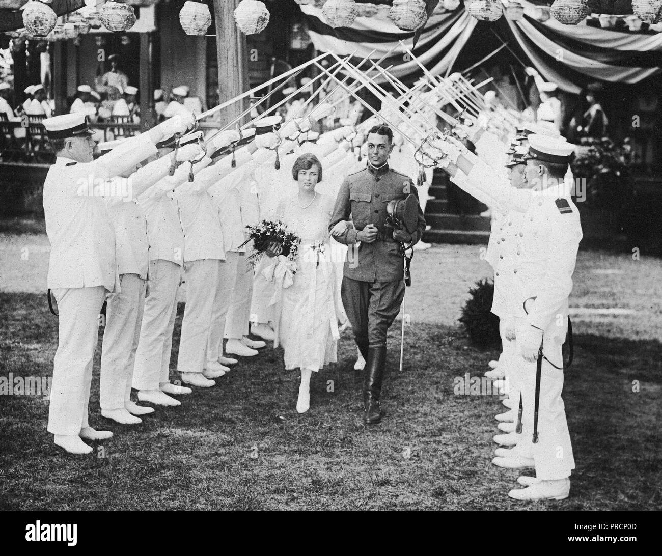 Photo shows a bridal couple coming through the arch of swords at Pelham ...
