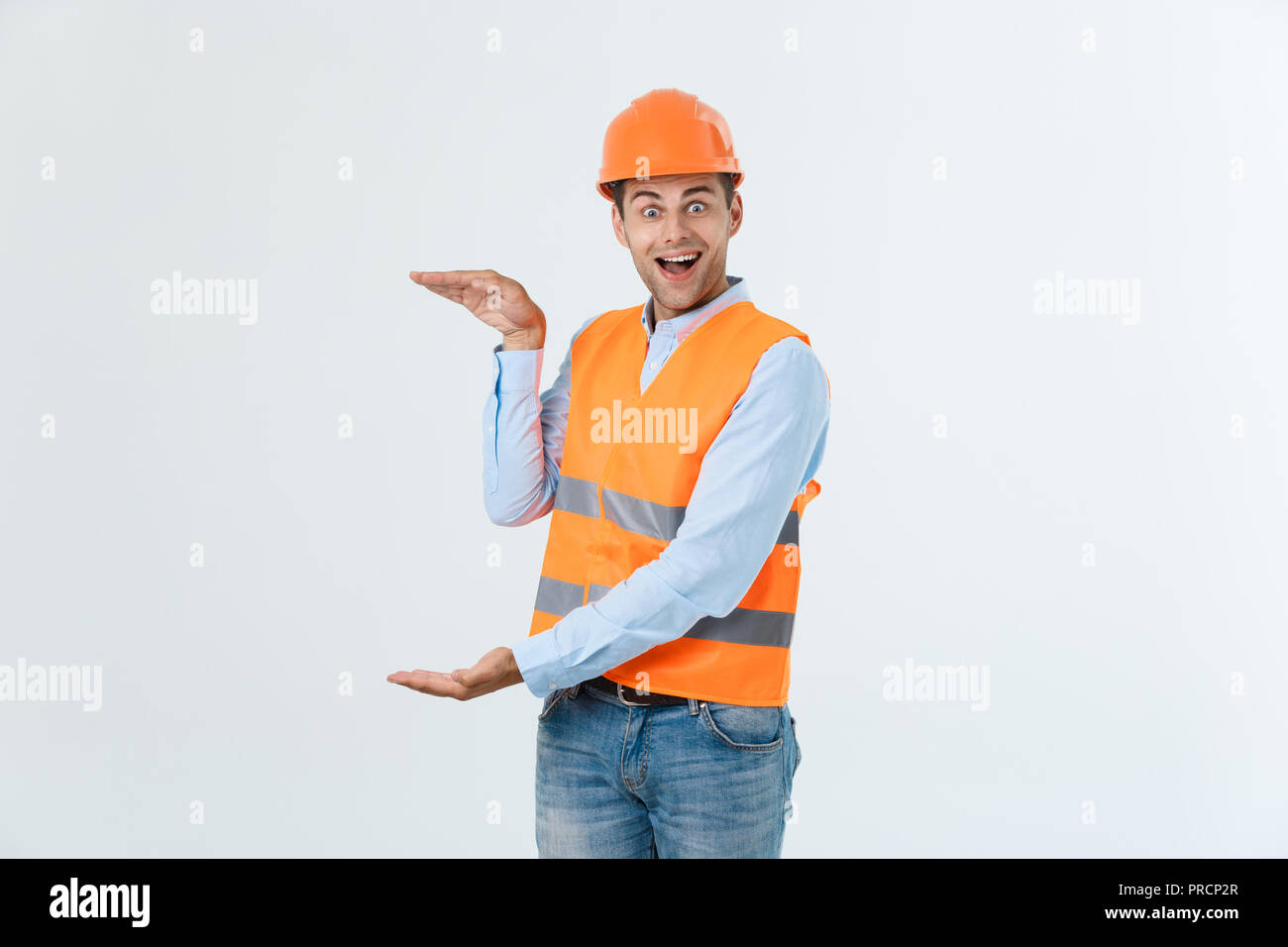 Happy beard engineer holding hand on side and explaining something, guy ...