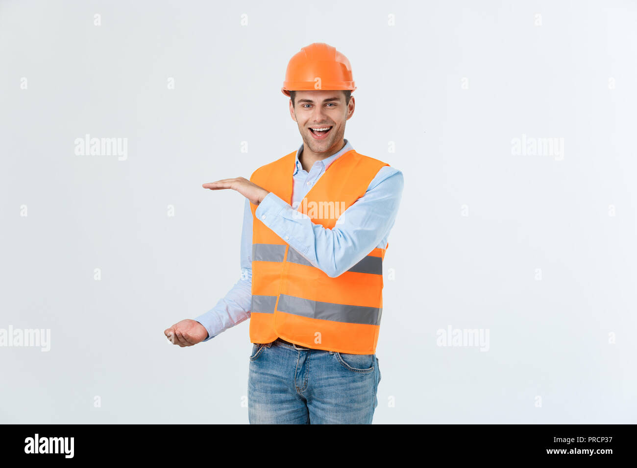 Happy beard engineer holding hand on side and explaining something, guy ...