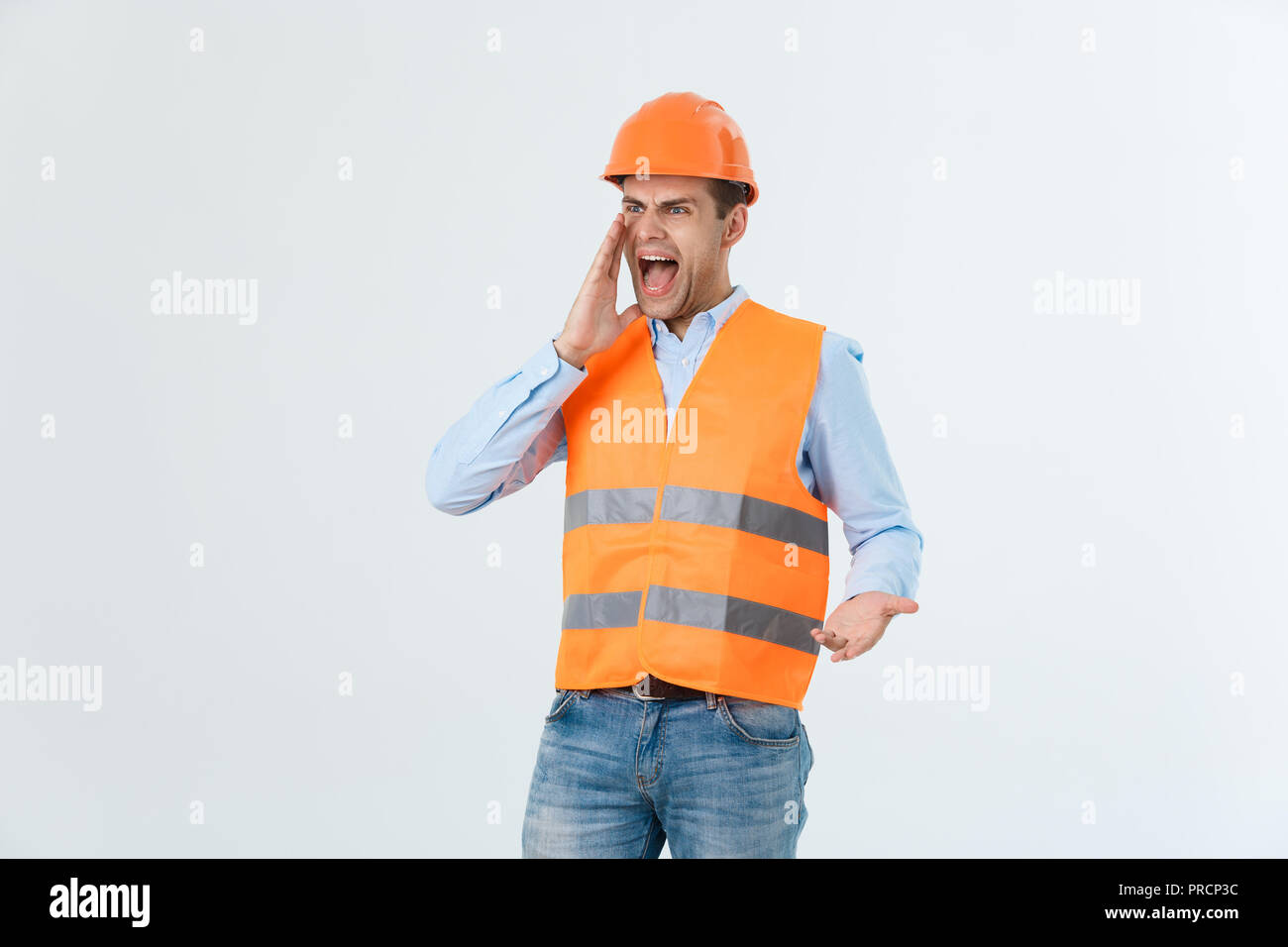 Angry builder or constructor yelling at somebody as fury concept ...