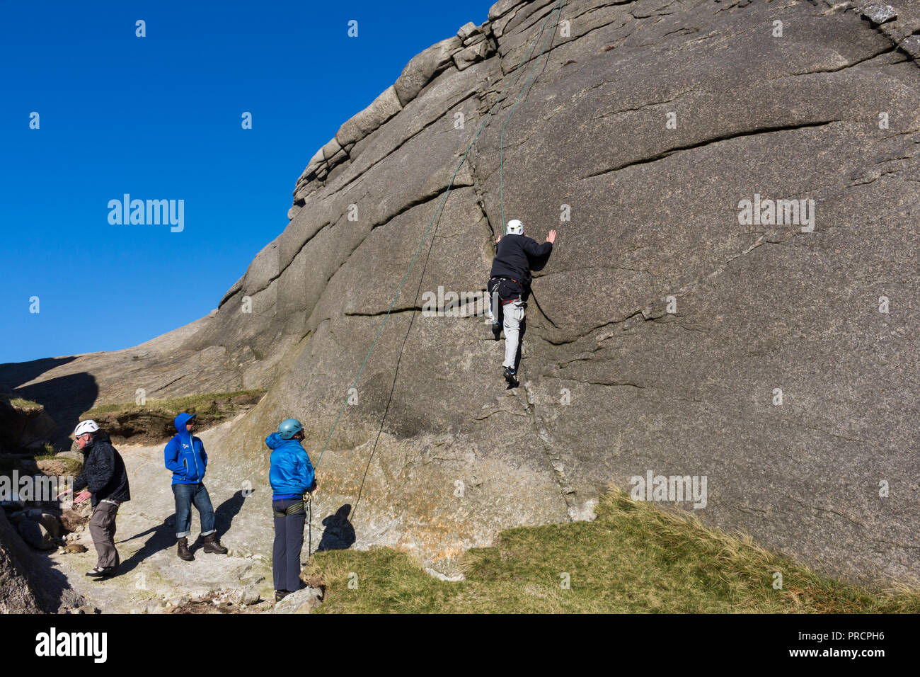 Climbers at a crag on Hen Mountain, Mourne Mountains, N.Ireland Stock ...