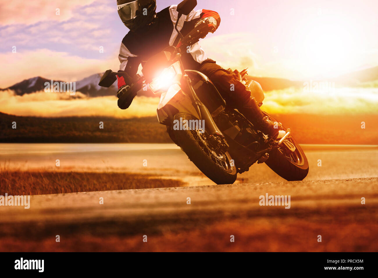 man riding sport motorcycle on asphalt highway Stock Photo - Alamy