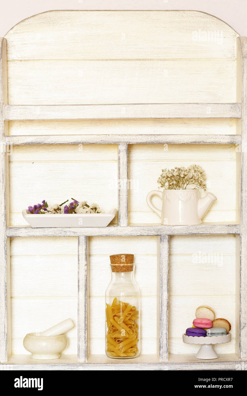 kitchen wooden white cupboard background with utensils and food Stock ...