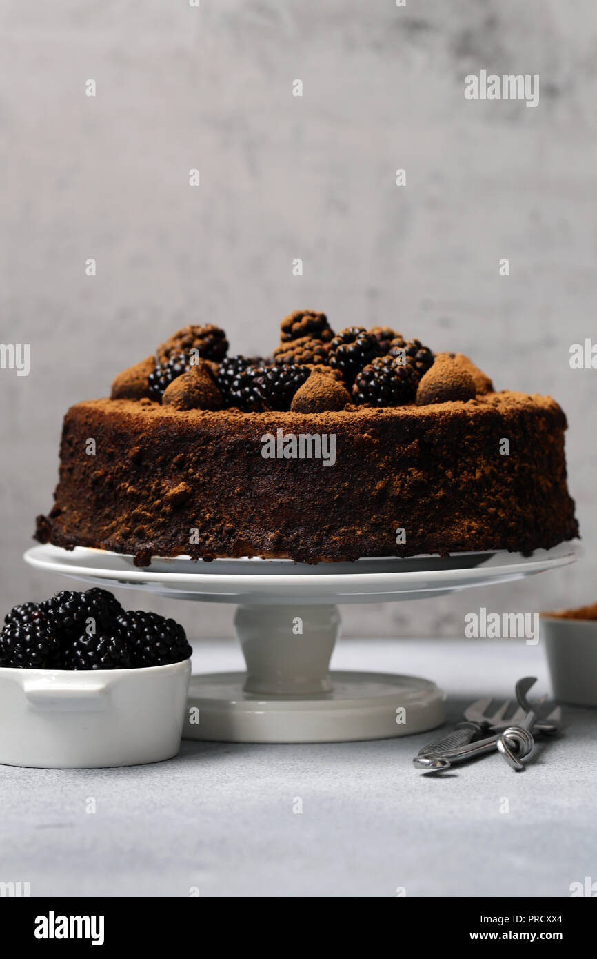 super chocolate truffle cake with black raspberries Stock Photo - Alamy