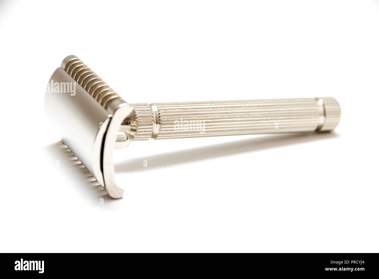 Traditional double edge open comb safety razor isolated on white ...