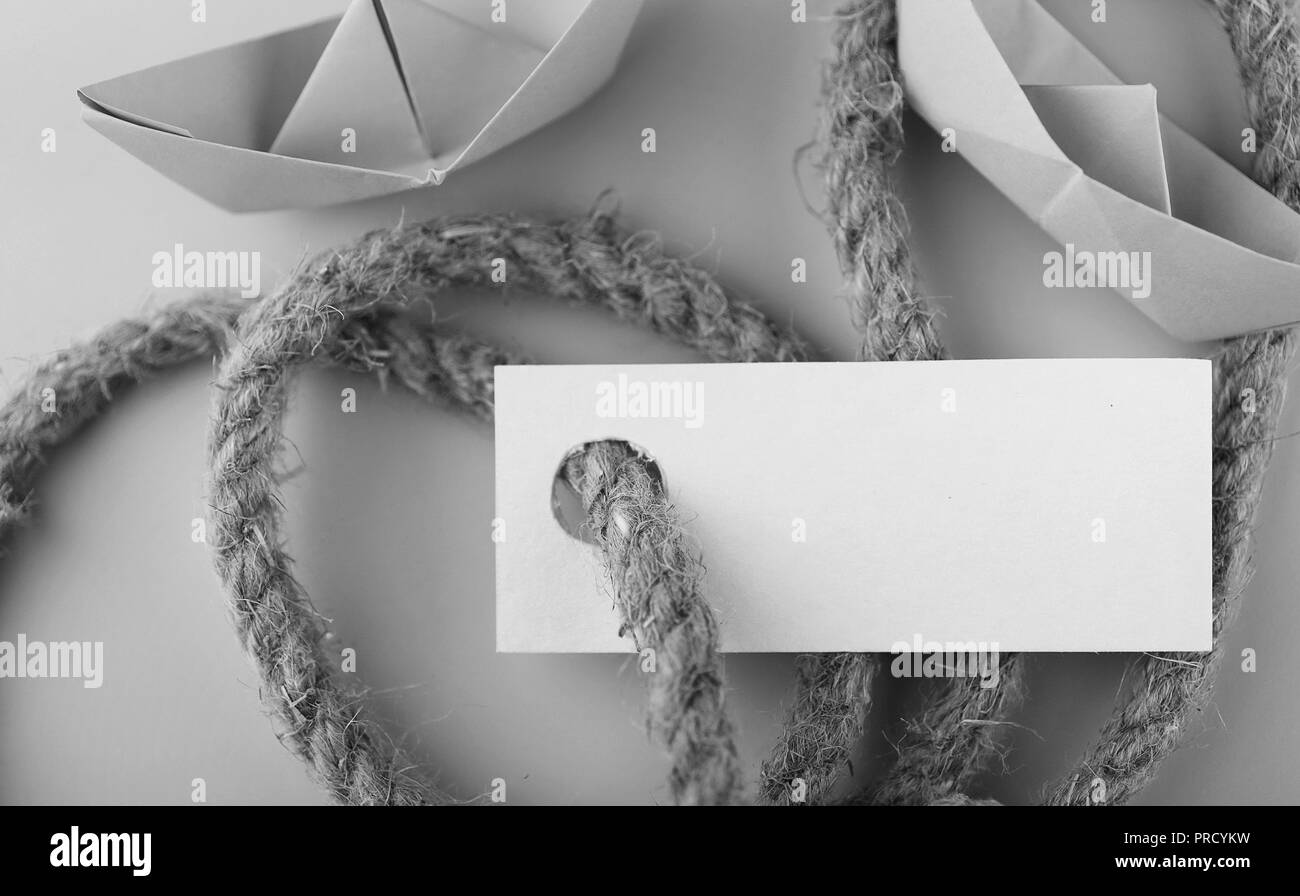 white sticker with thick braided rope and ship paper origami Stock ...