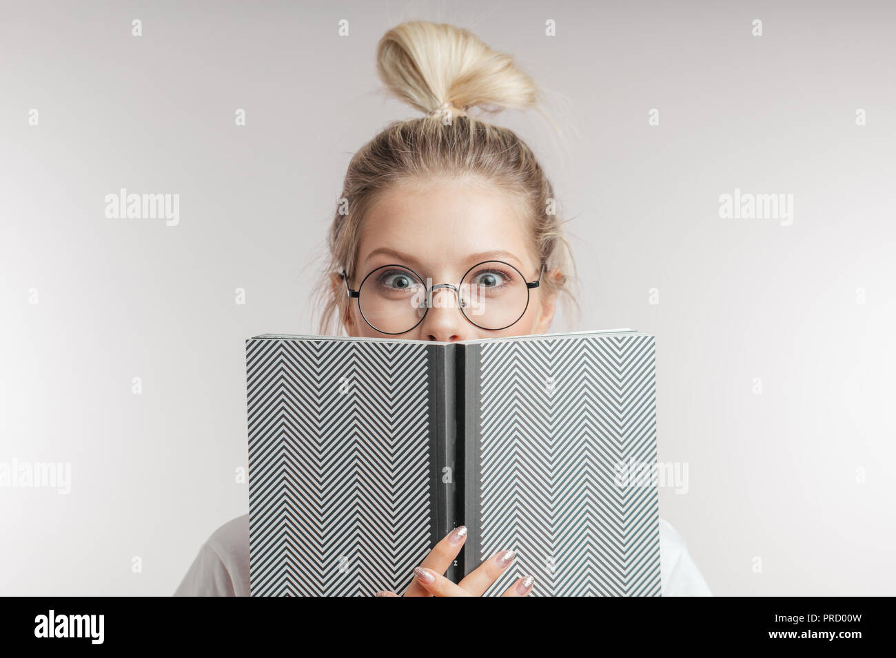 Hide behind open book hi-res stock photography and images - Alamy