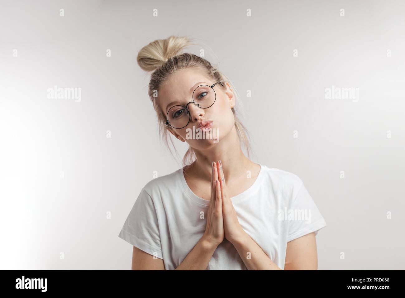 Pleading young woman begging with different emotions. Apology or Asking ...