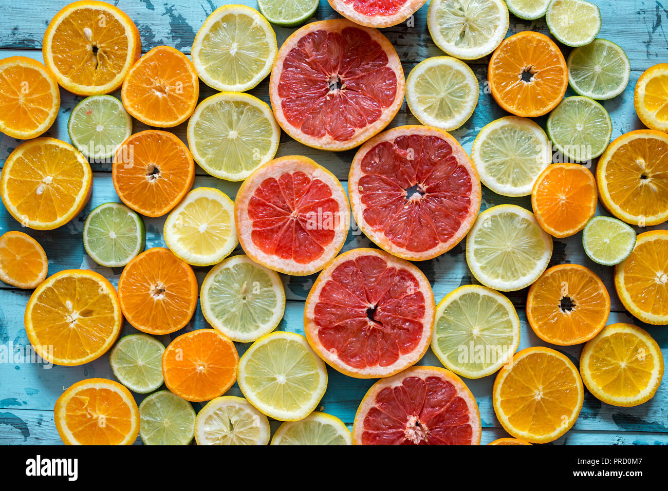 Raw food background of citrus multi coloured slices. Close-up Stock ...