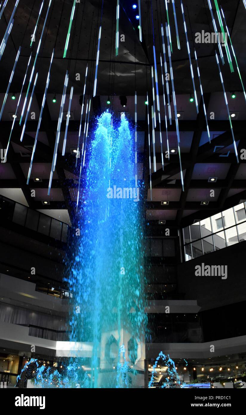 indoor water fountain lit up blue Stock Photo - Alamy