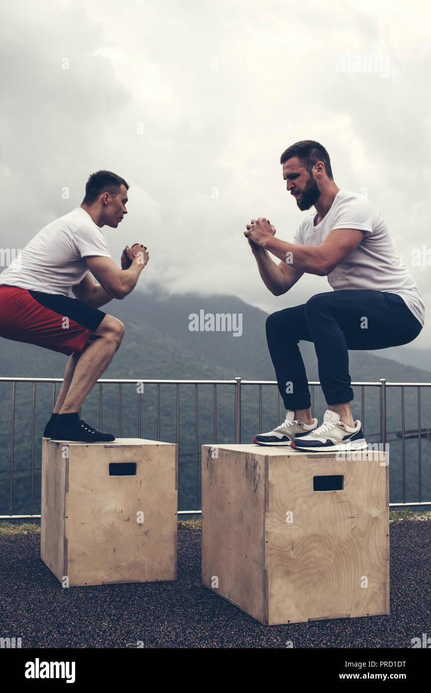 Group young friends doing jump hi-res stock photography and images - Alamy