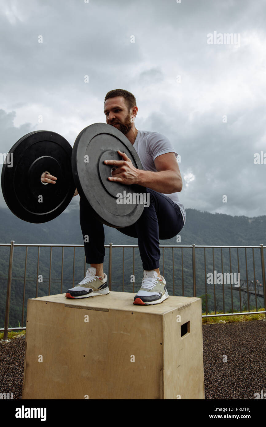 Young man jumps block hi-res stock photography and images - Alamy
