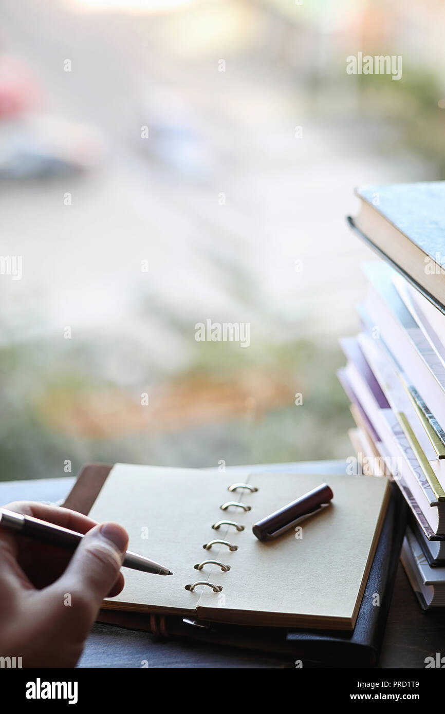 Books on a desk colourful hi-res stock photography and images - Alamy